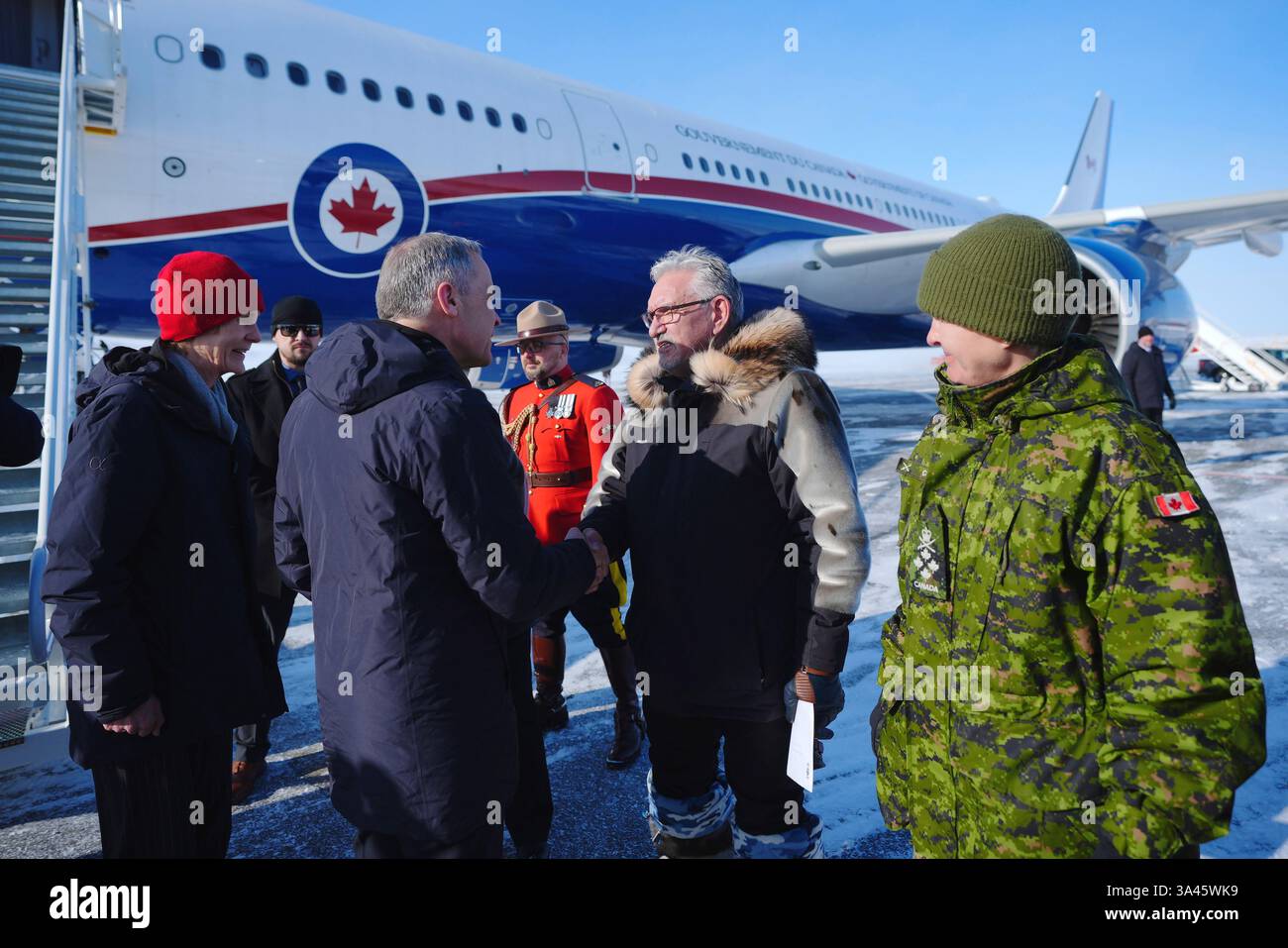 Canada Prime Minister Mark Carney, second from left, shakes hands with ...