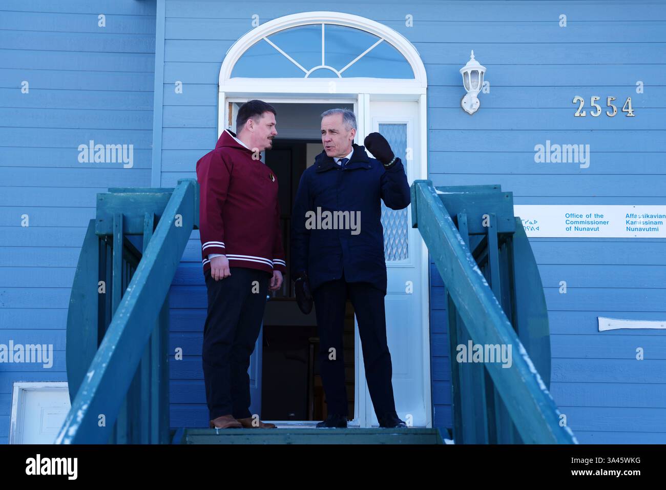 Canada Prime Minister Mark Carney, right, speaks with Nunavut Premier P ...