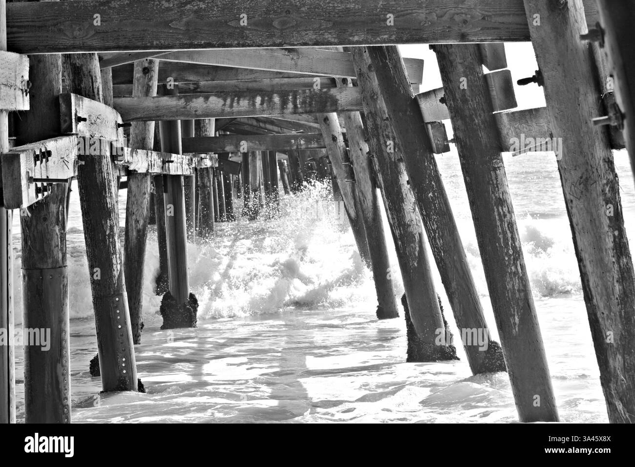 Beach sea pier under Black and White Stock Photos & Images - Alamy