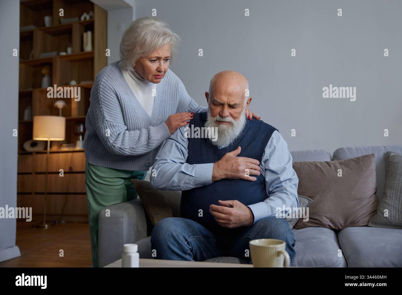 Worried aged woman and old man feeling discomfort in heart area ...