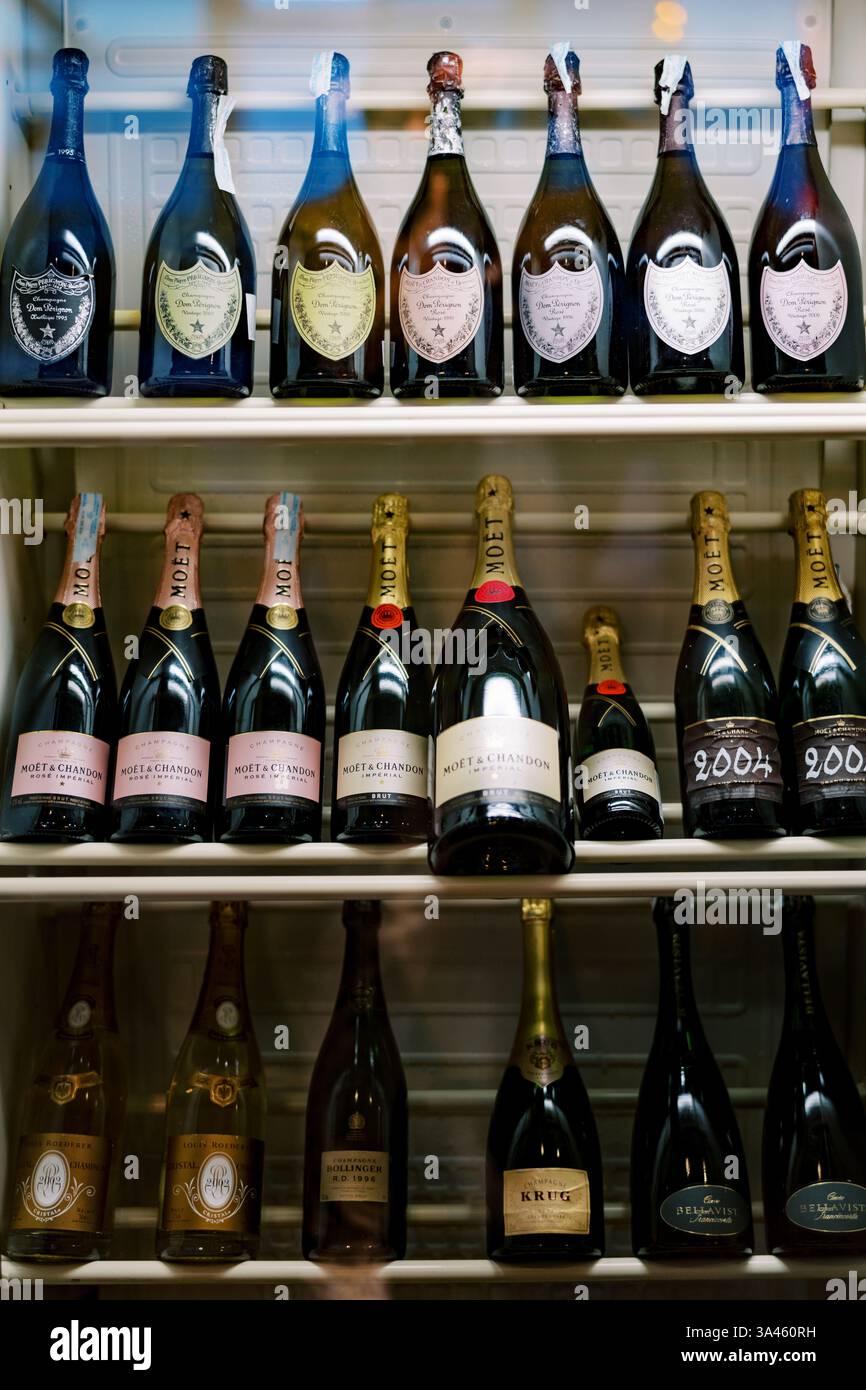 USA, Seattle - March 04, 2025: Rows of champagne line the shelves of ...