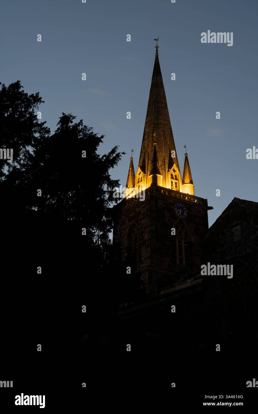 St Marys Church at lit up at dusk in Adderbury, Oxfordshire, England ...