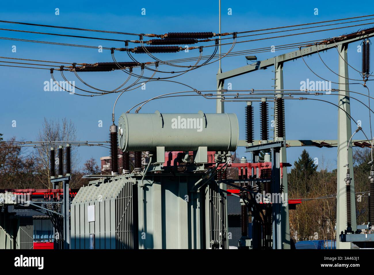 Utility equipment is showcased at a power station during the day, with ...