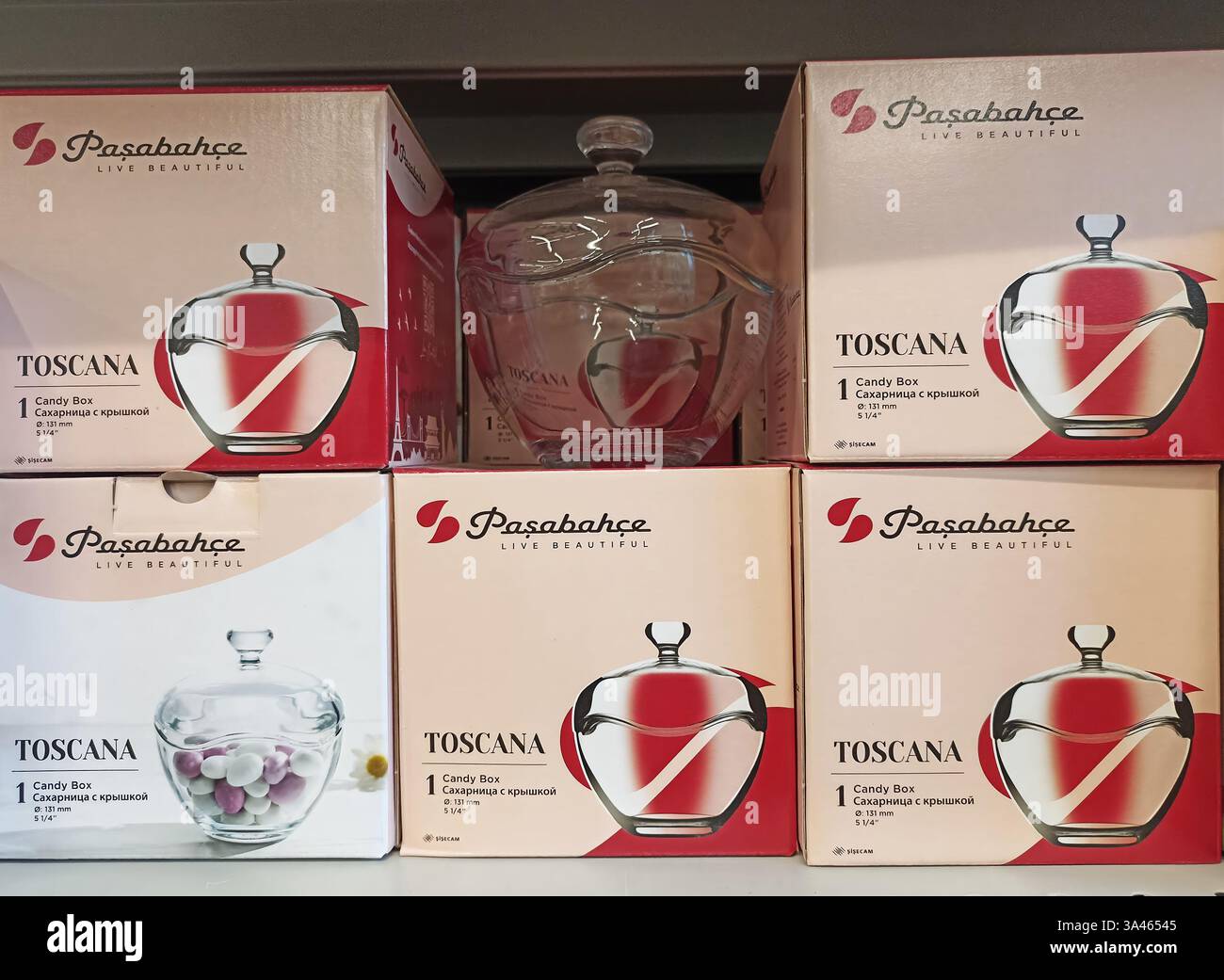 Glass candy boxes display with red accents on store shelf Stock Photo ...