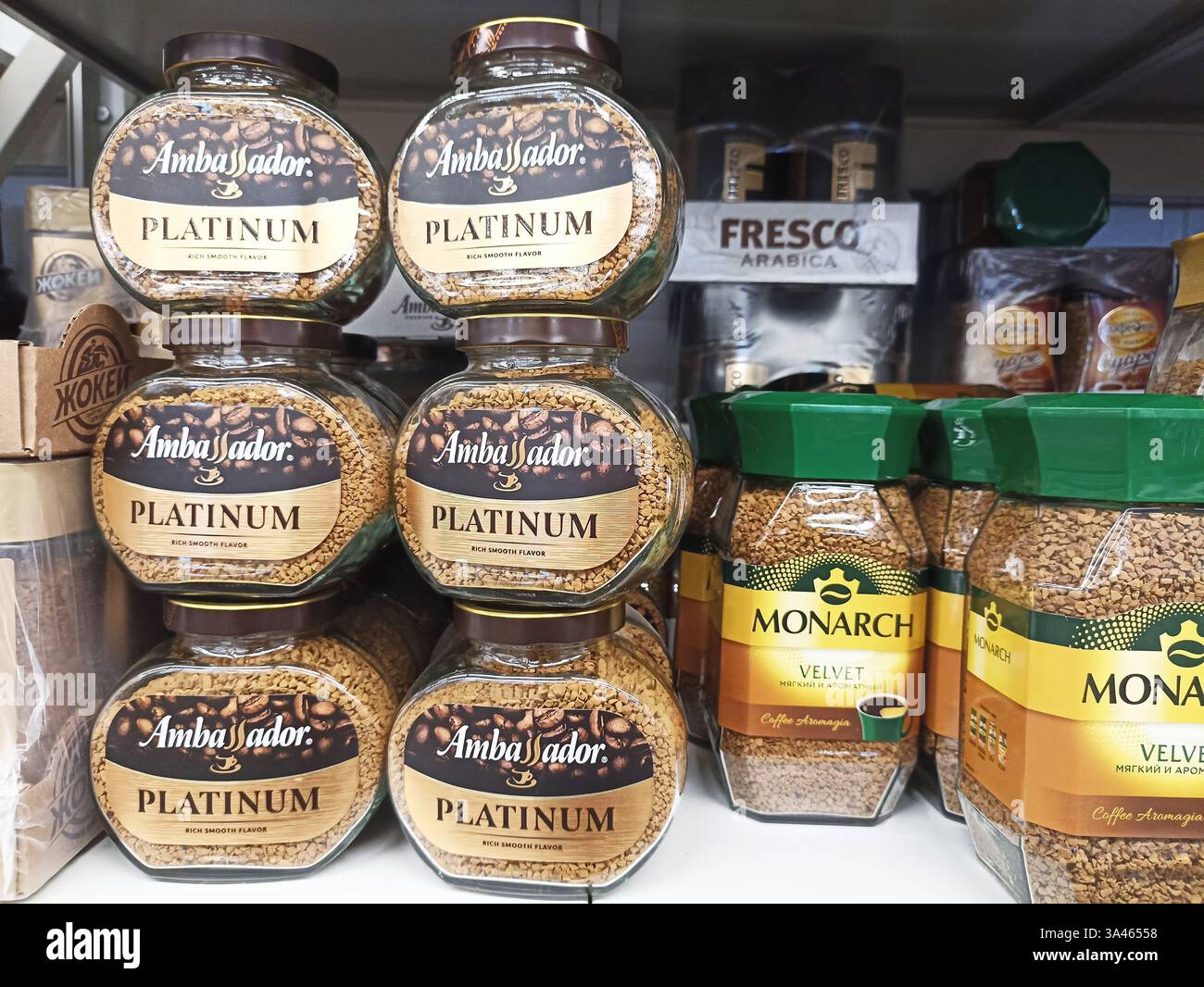 Assorted instant coffee jars on shelves with various brands and ...