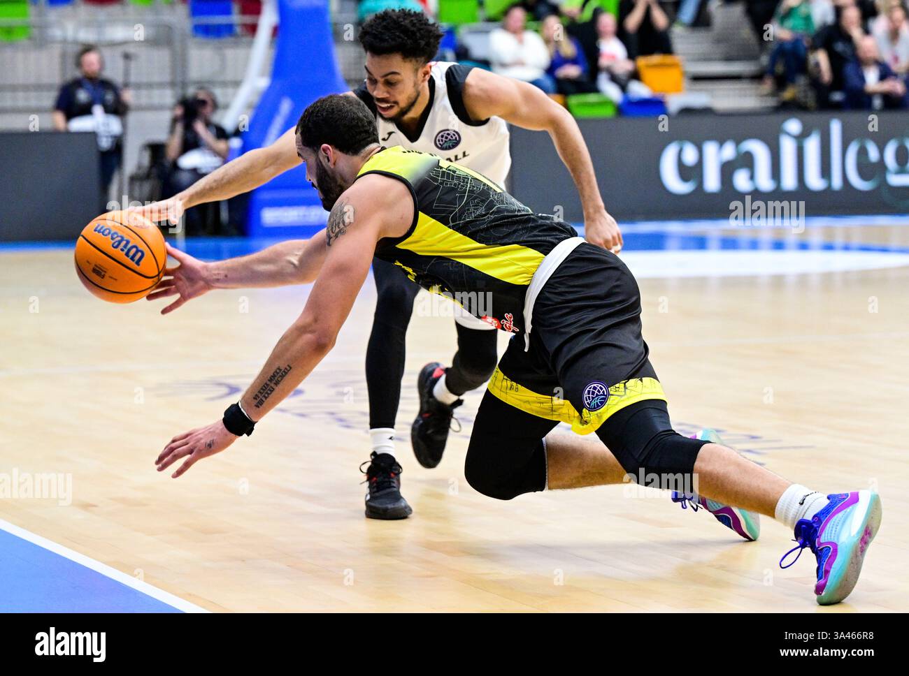 Trey Diggs of Szombathely, left, and Stephen Brown of Nymburk in action ...