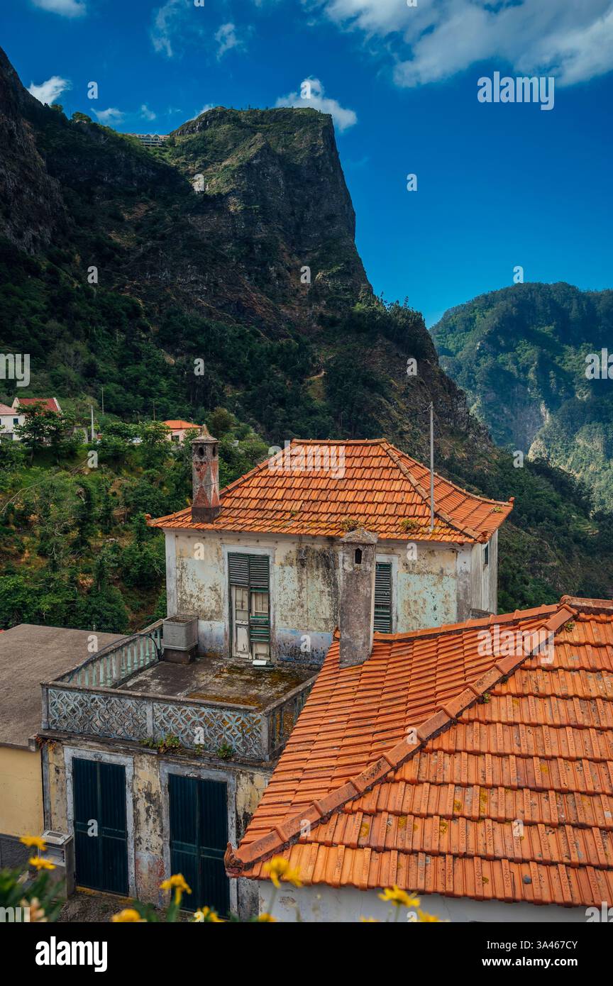 Red teraccotta roofed buildings in the valley of the Nuns, with Eira Do ...