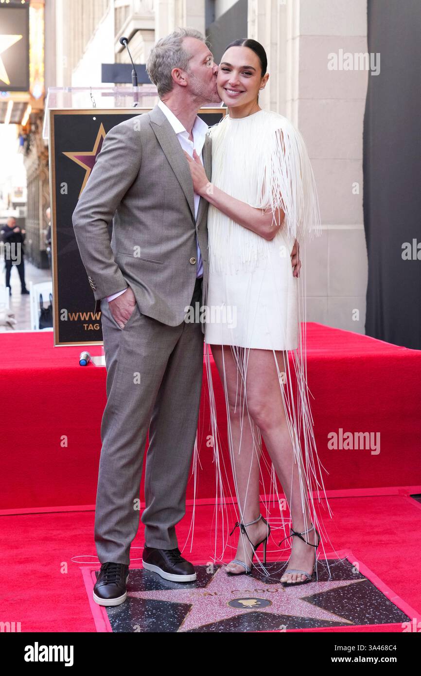 Jaron Varsano, left, and Gal Gadot pose atop Gadot's new star at a ...
