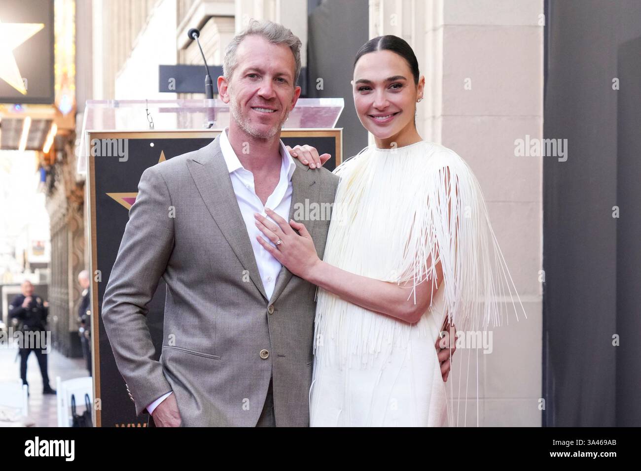 Jaron Varsano, left, and Gal Gadot pose atop Gadot's new star at a ceremony on the Hollywood ...