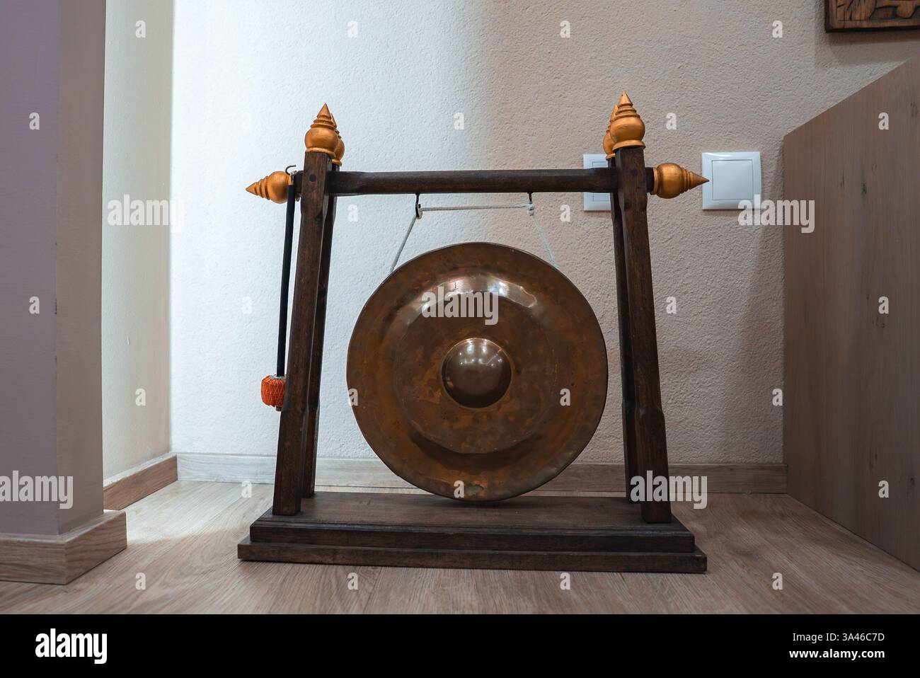 Decorative Gong with Wooden Frame and Golden Finials Indoors Stock ...