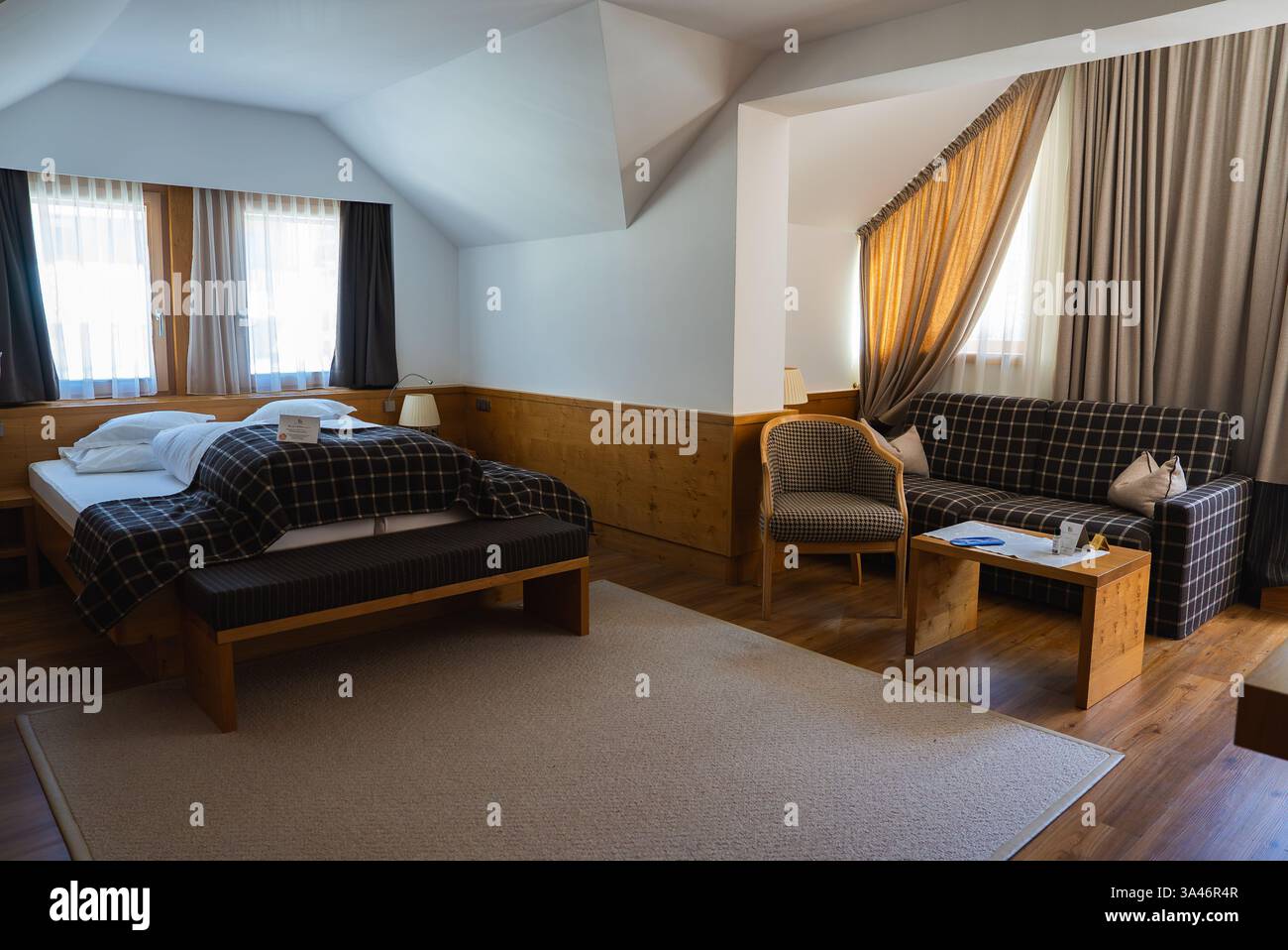 Cozy Alpine Hotel Room with Wooden Interior and Sloped Ceiling Stock ...
