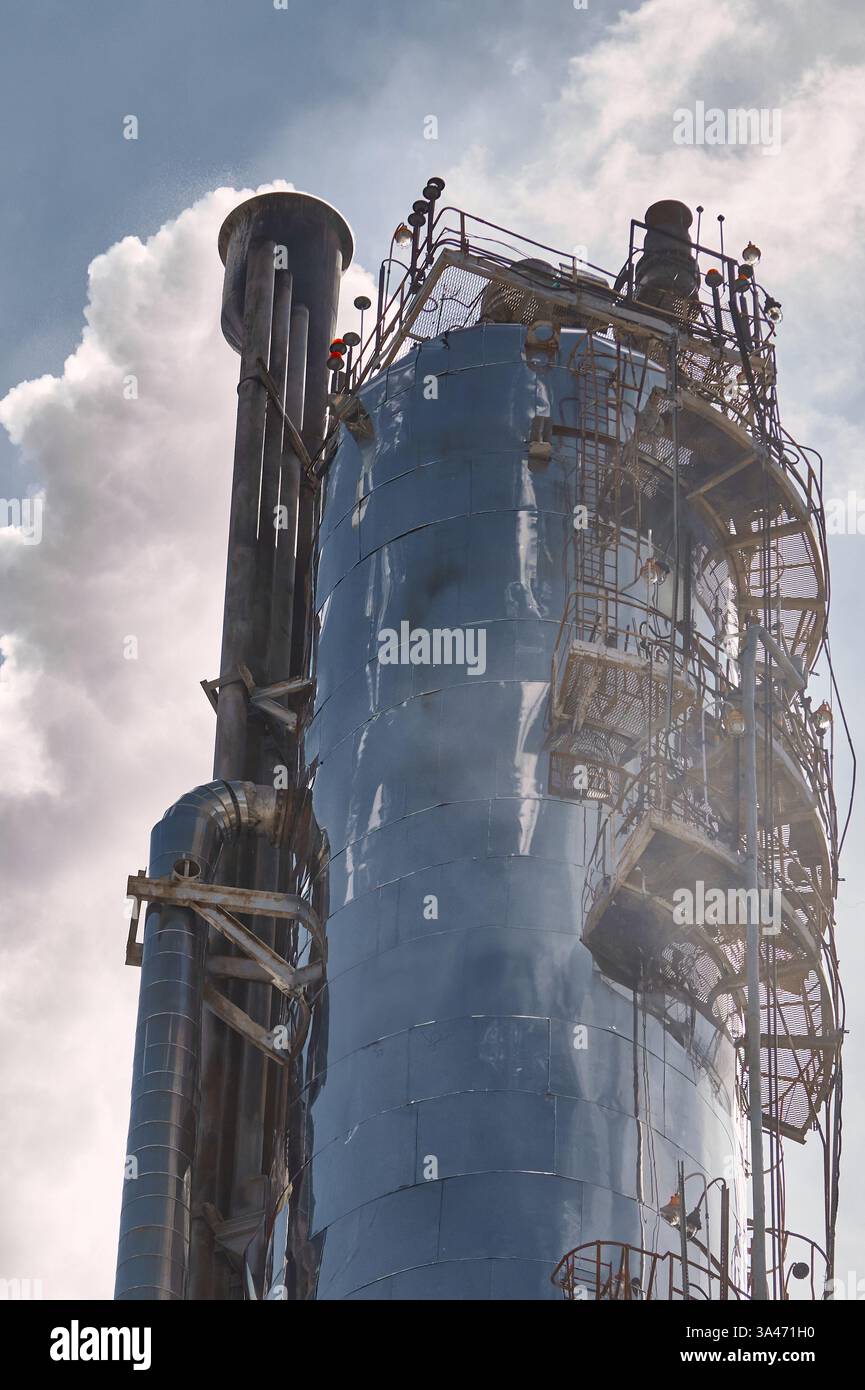 High-resolution view of a distillation column in a chemical plant under ...
