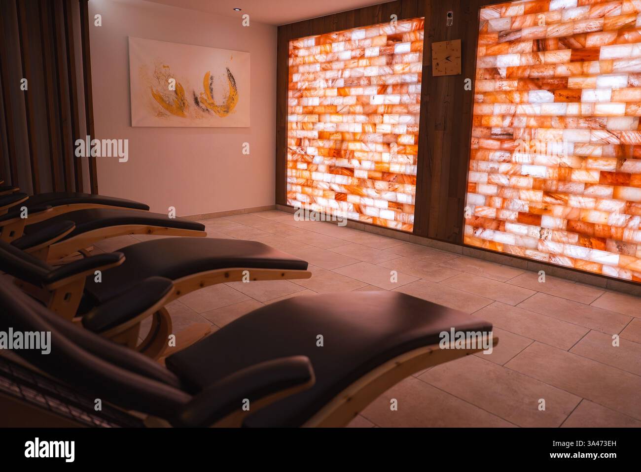 Relaxation Room with Salt Brick Wall and Curved Lounge Chairs Stock ...
