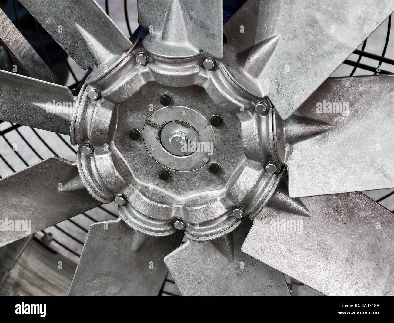 Intricate design of an industrial fan highlighting metal blades and ...