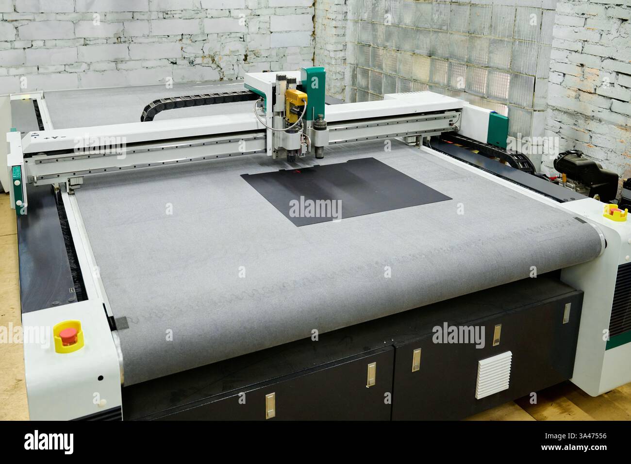 Wide format CNC plotter at work creating intricate designs in a ...