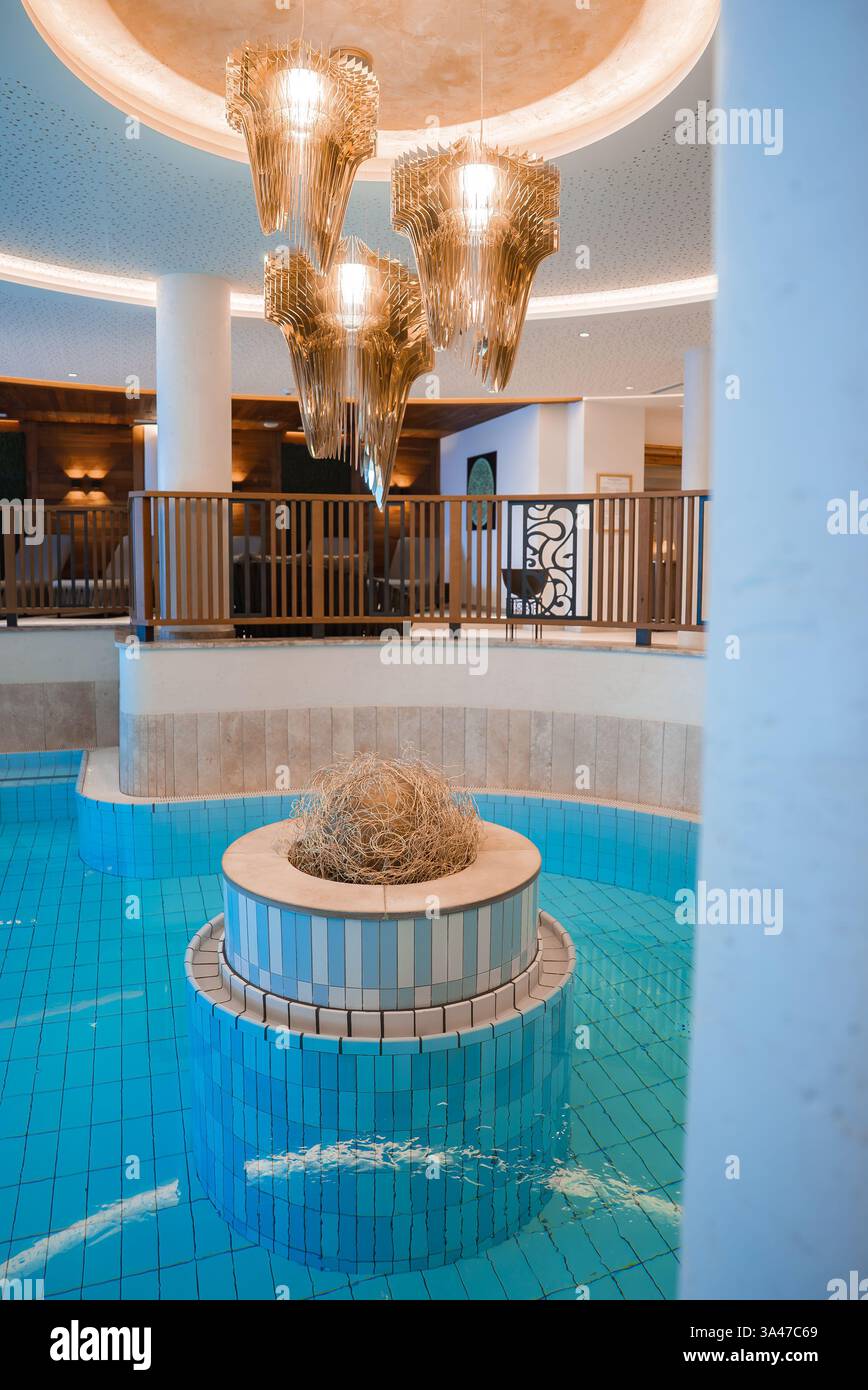 Indoor Pool with Circular Structure and Golden Chandeliers in Ischgl ...