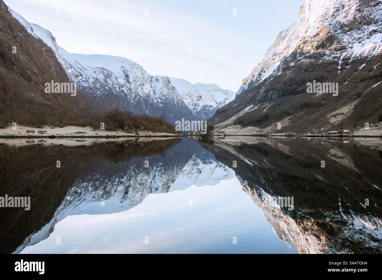 A landscape photo of Norwegian fjords, where majestic snow-covered ...