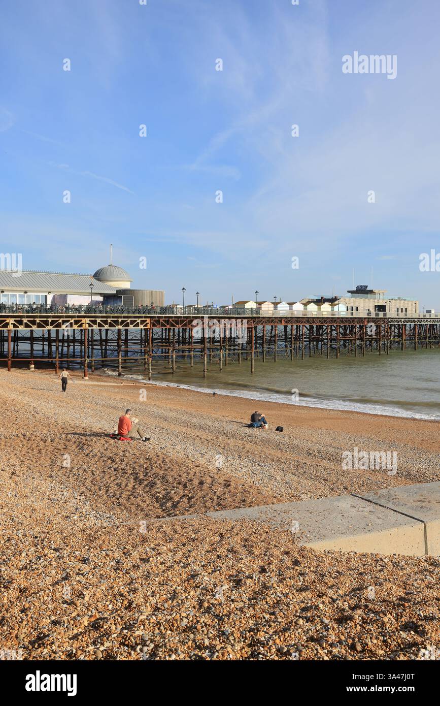 Hastings pier from St Leonards-on-Sea beach in early spring sunshine ...