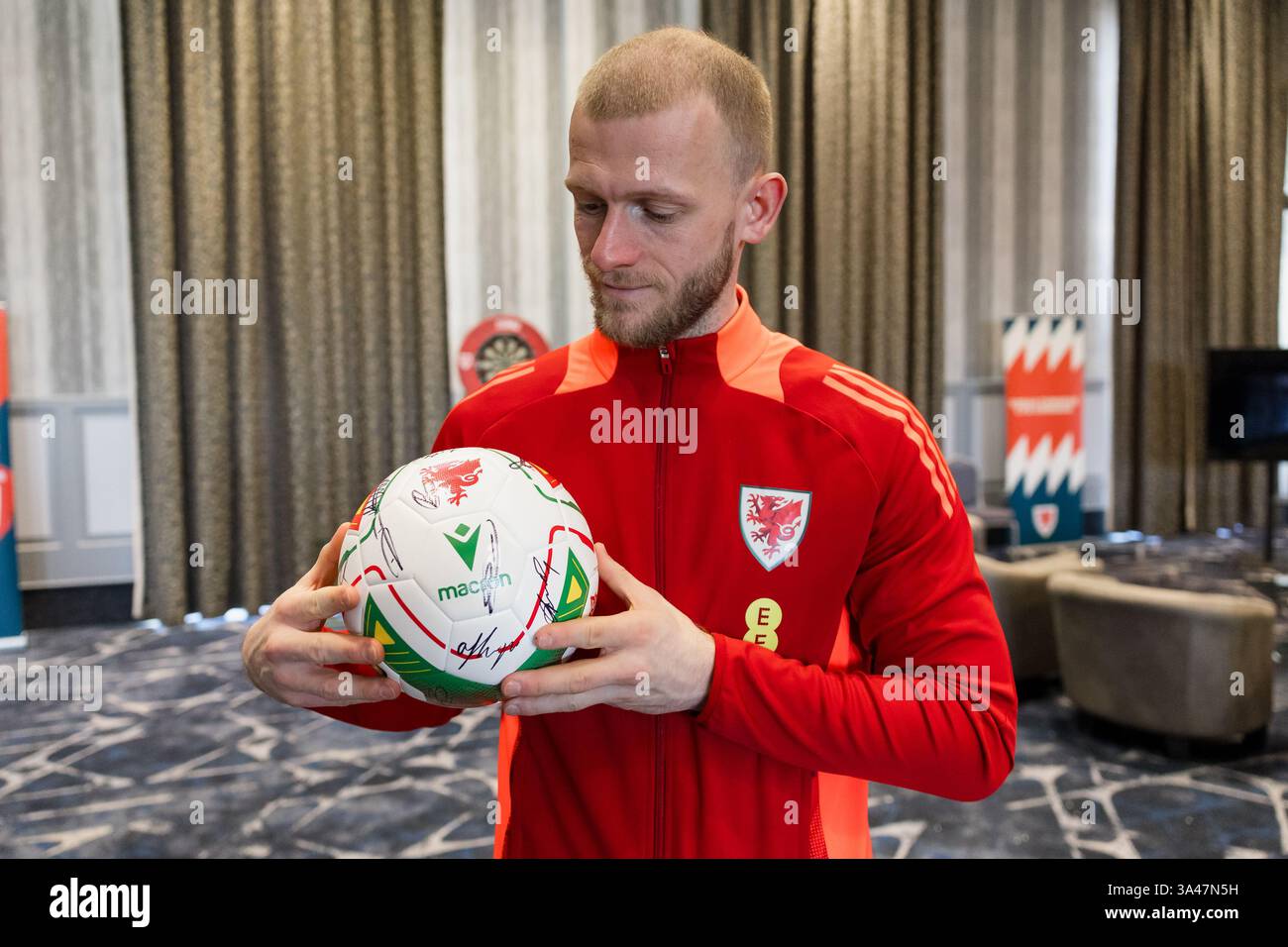 PONTYCLUN, UK. 18th Mar, 2025. Wales' goalkeeper Adam Davies posses ...