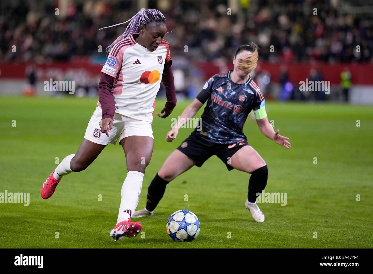 Lyon's Kadidiatou Diani runs with the ball past Bayern's Sarah Zadrazil ...