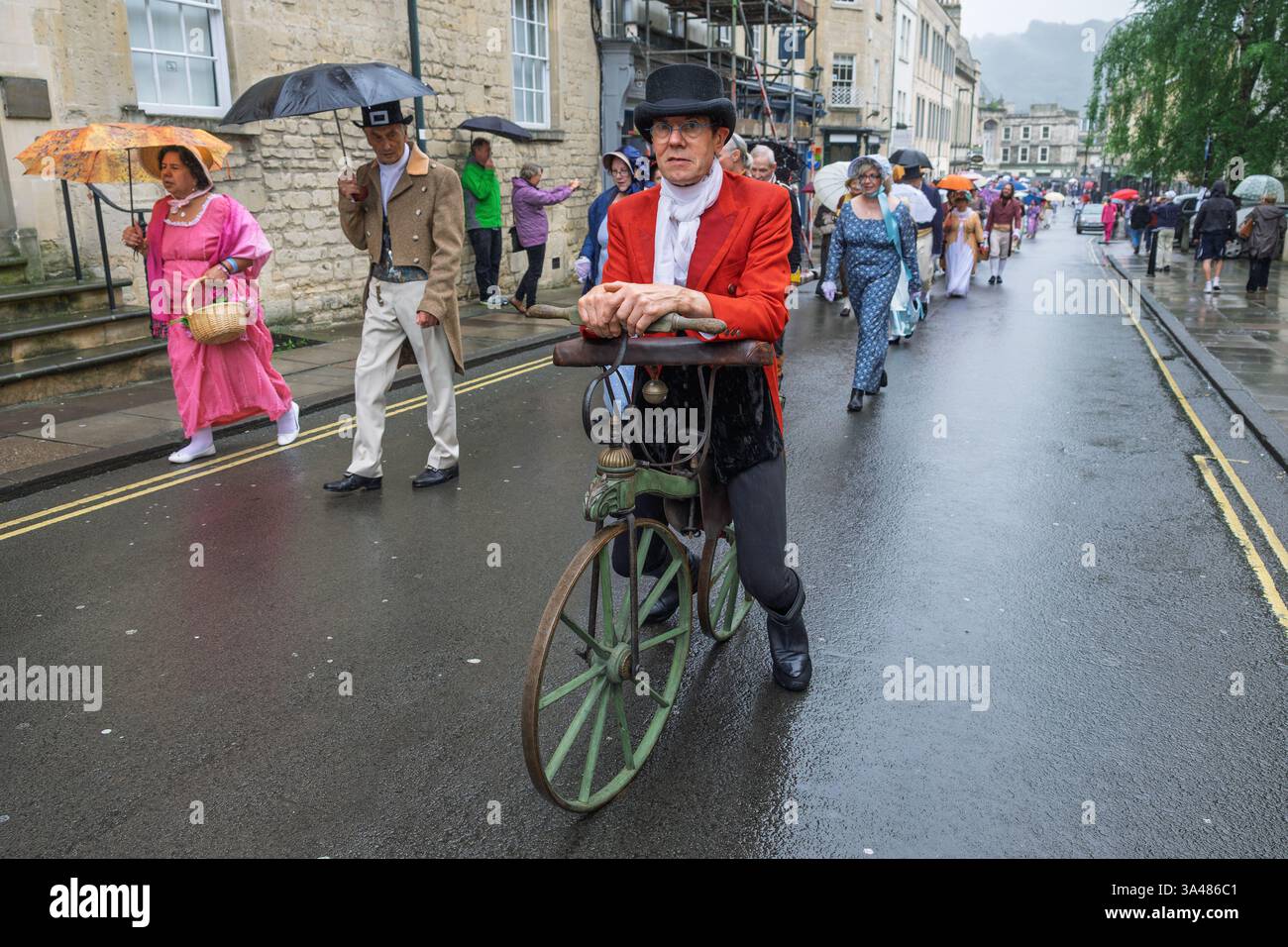 Jane Austen Bath festival fans including a man riding a velocipede take ...