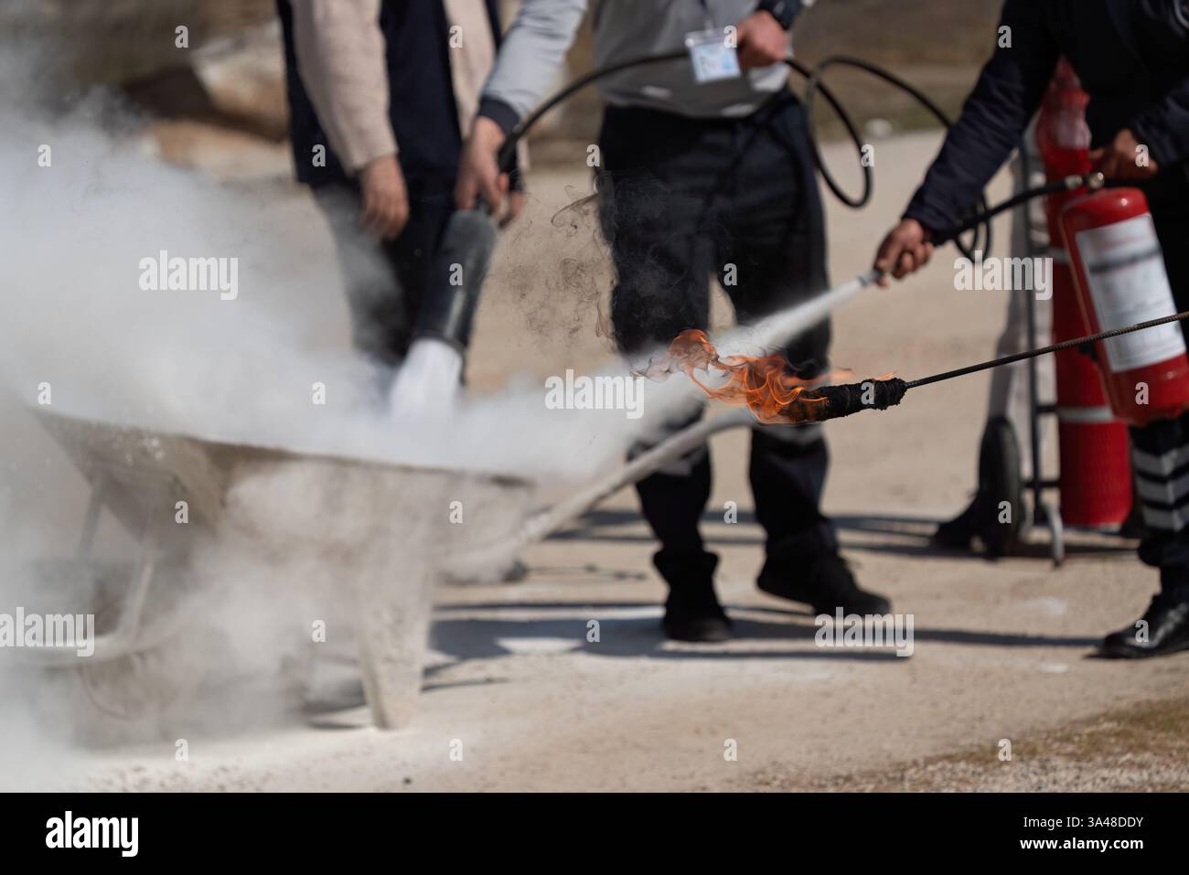 Fire extinguisher used during fire drill in Turkey Stock Photo - Alamy