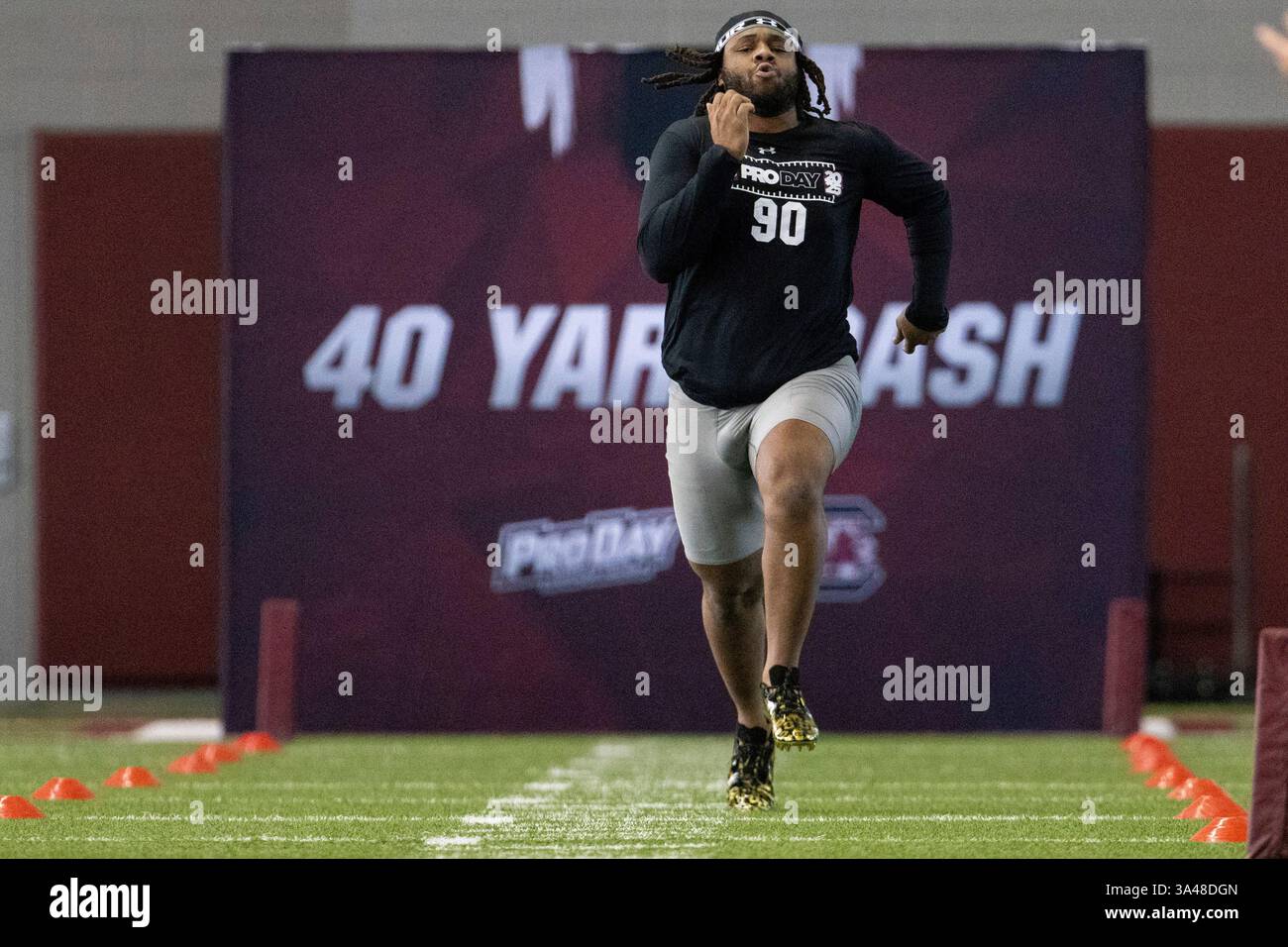 South Carolina defensive tackle T.J. Sanders (90) runs the 40 yard dash ...