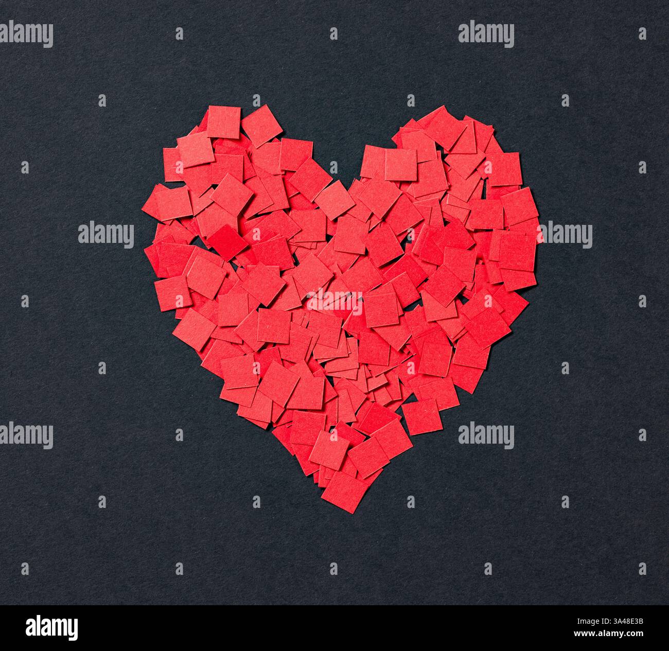 heart shape sign made from small pieces of red colored applique paper ...