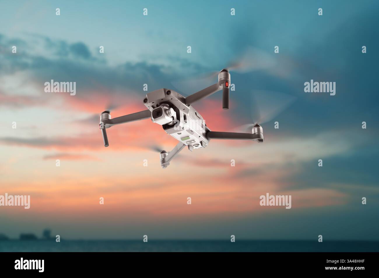 Drone with camera flying in sky. Unmanned aerial vehicle for ...