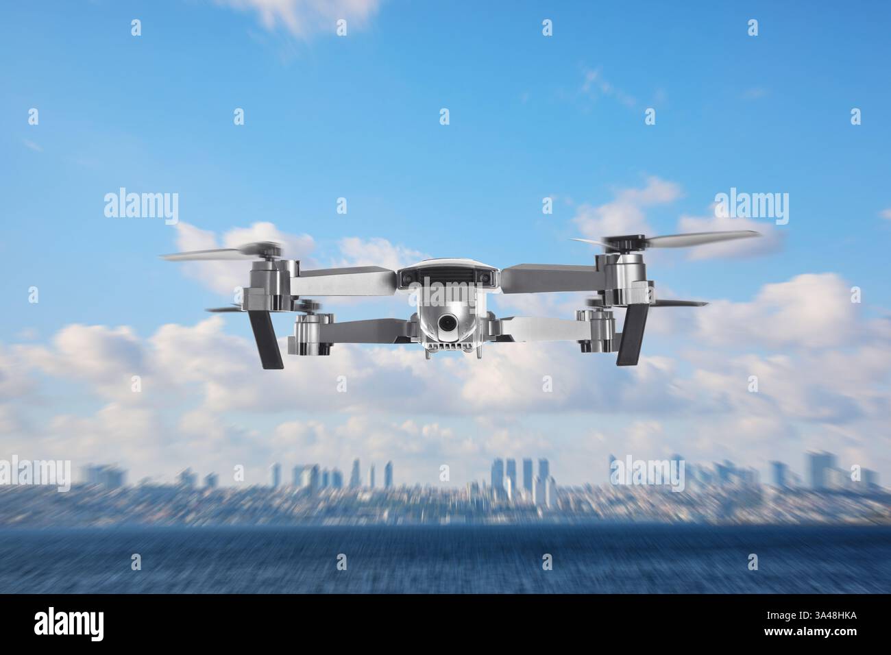 Drone with camera flying over sea. Unmanned aerial vehicle for ...