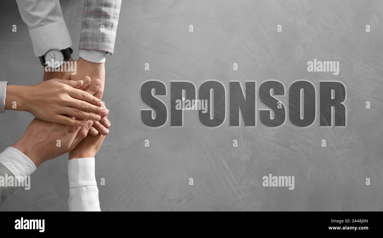 Sponsor. People holding hands together over grey stone background, top ...