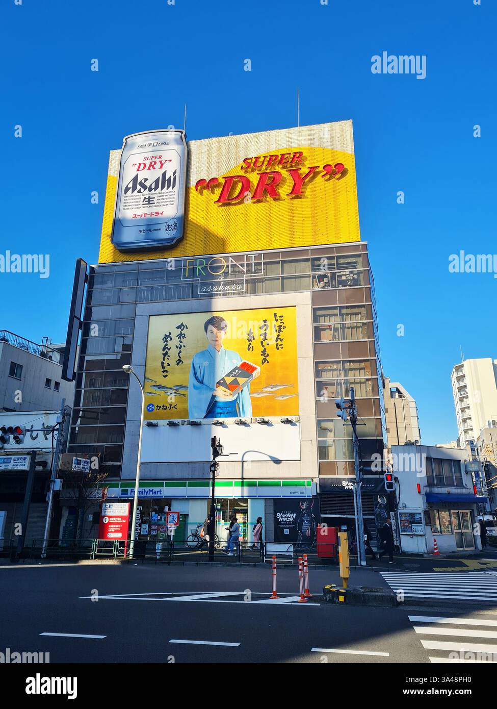 Asakusa district in Tokyo, Japan at a junction with a large yellow ...