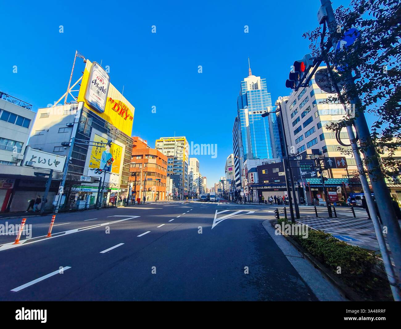 Asakusa district in Tokyo, Japan at a junction with a large yellow ...