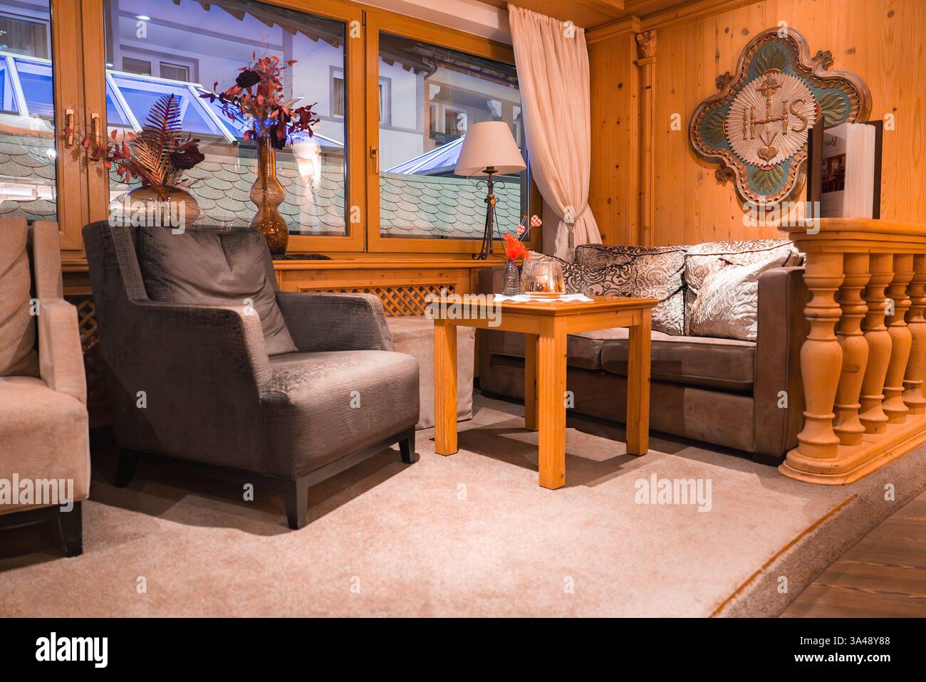 Cozy Lounge Area with Wooden Paneling and Alpine Views Stock Photo - Alamy