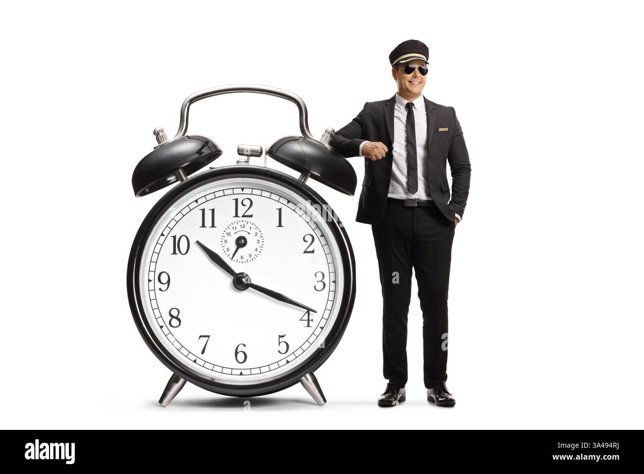 Pilot leaning on an alarm clock isolated on white background Stock ...