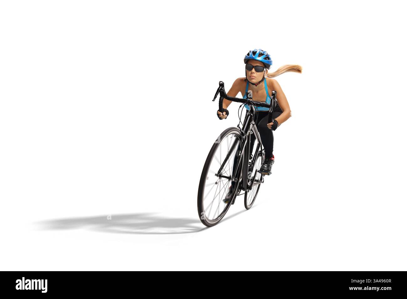 Female cyclist riding a bicycle fast isolated on white background Stock ...