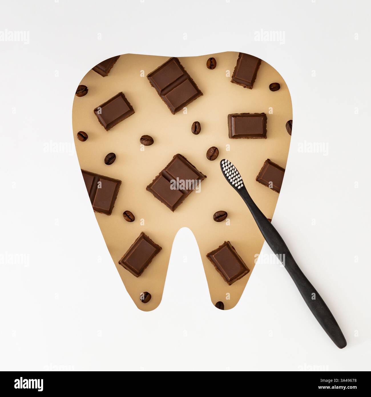 Creative layout with chocolate bars, coffee beans, toothbrush and tooth ...