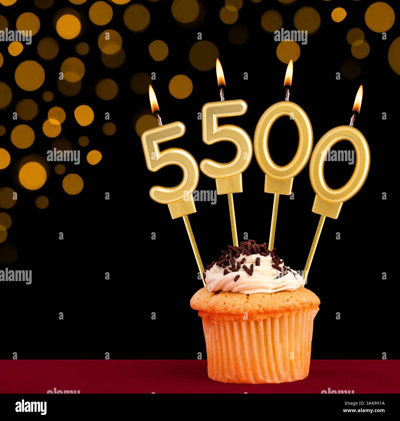 Birthday candle with cupcake - Number 5500 on black background with out ...