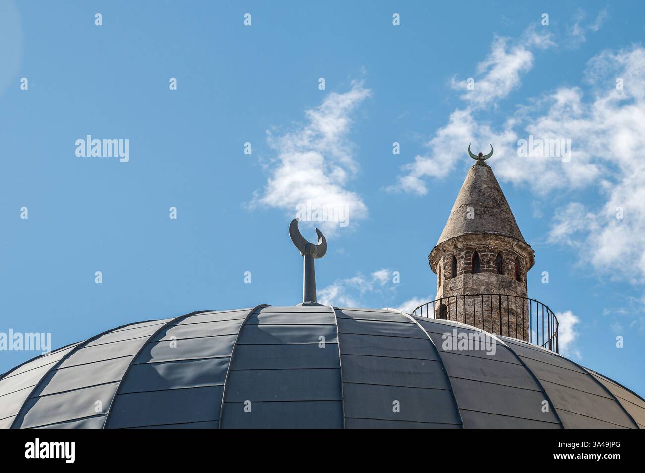 the roof of Jakovali Hassan Pasha Mosque against a blue sky, Pecs ...