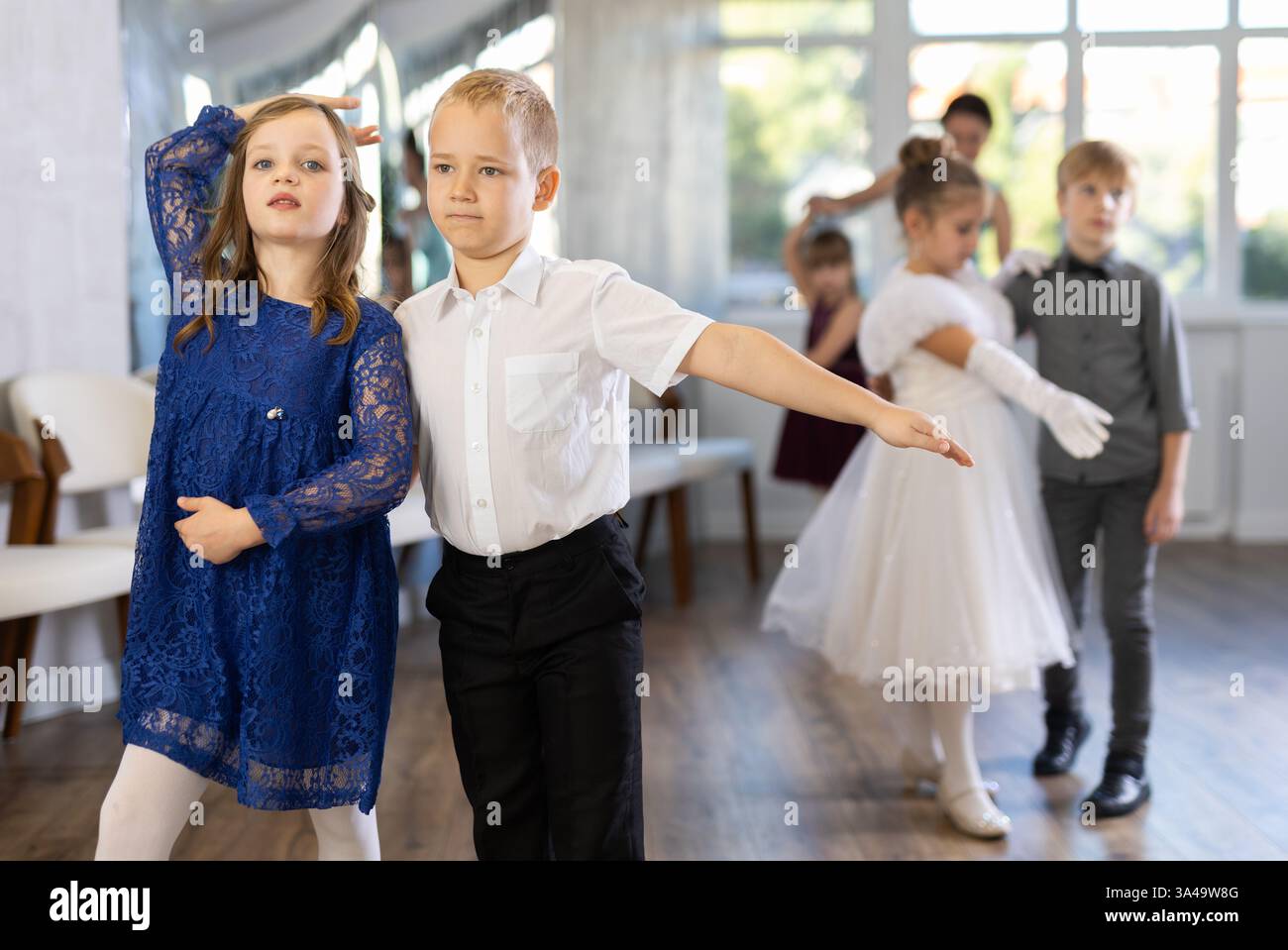 Classical dances performed by preteen children in festive clothes Stock ...