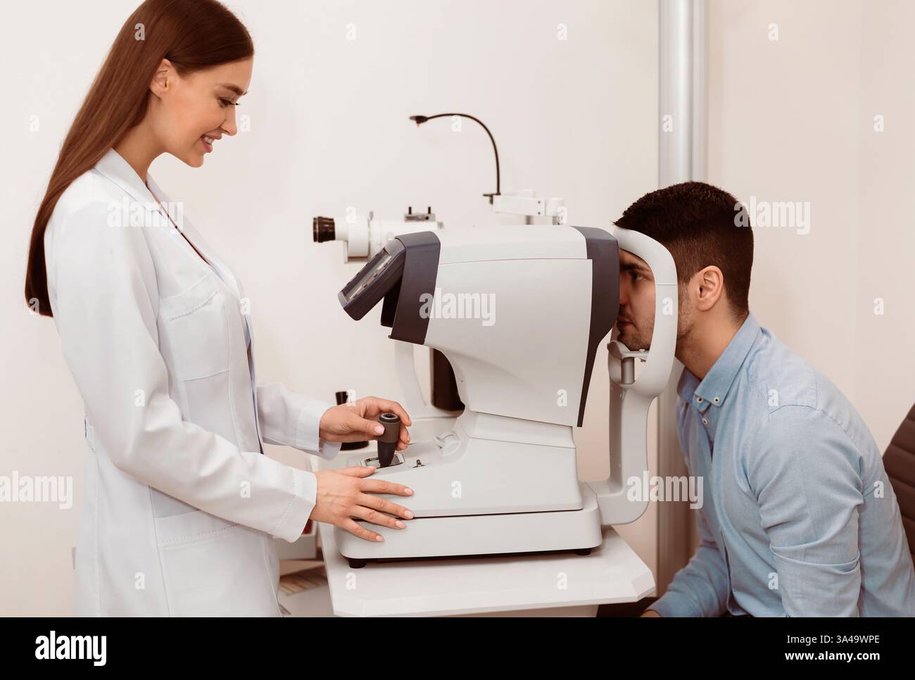 Eye examination at an optometry clinic with patient and optometrist ...