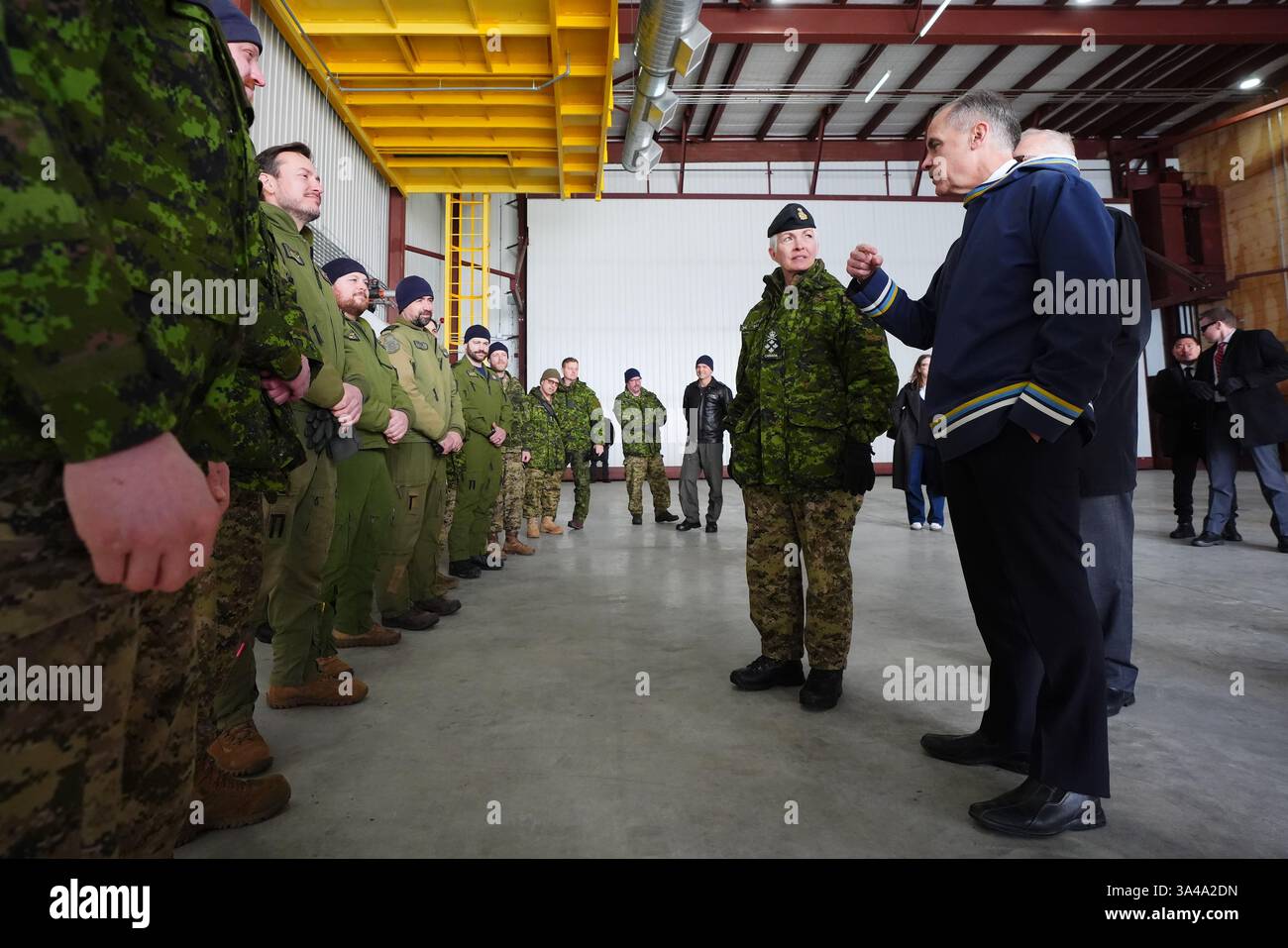 Iqaluit, Canada. 17th Mar, 2025. Prime Minister Mark Carney, right, and Chief of Defence Staff ...