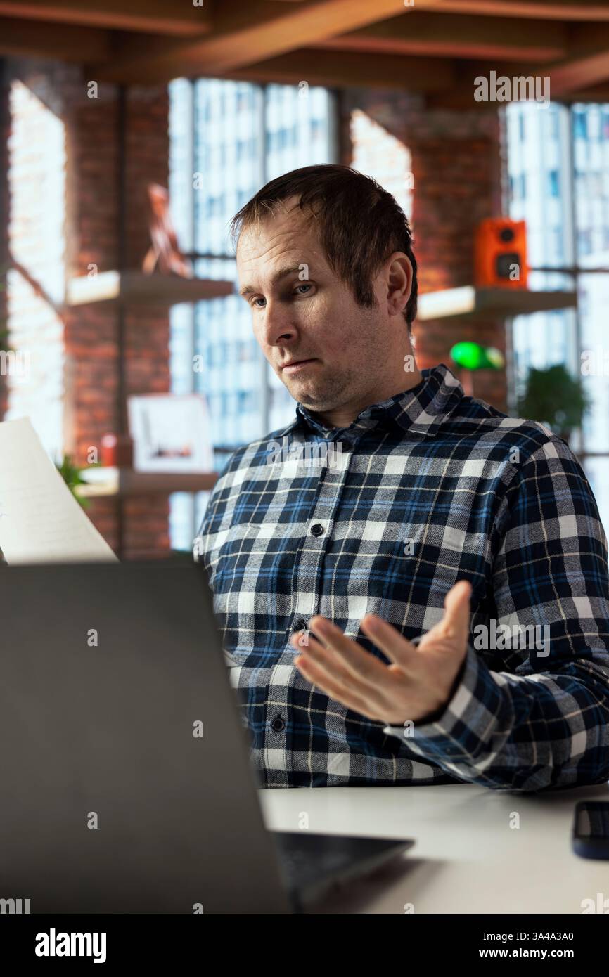Confused man reviewing documents hi-res stock photography and images ...