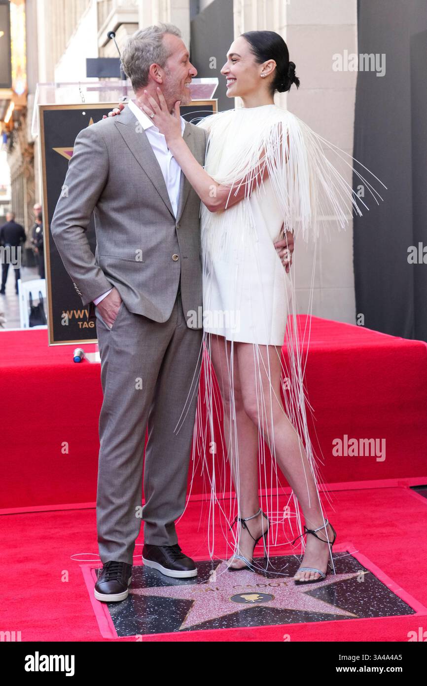 Jaron Varsano, left, and Gal Gadot pose atop Gadot's new star at a ceremony on the Hollywood ...