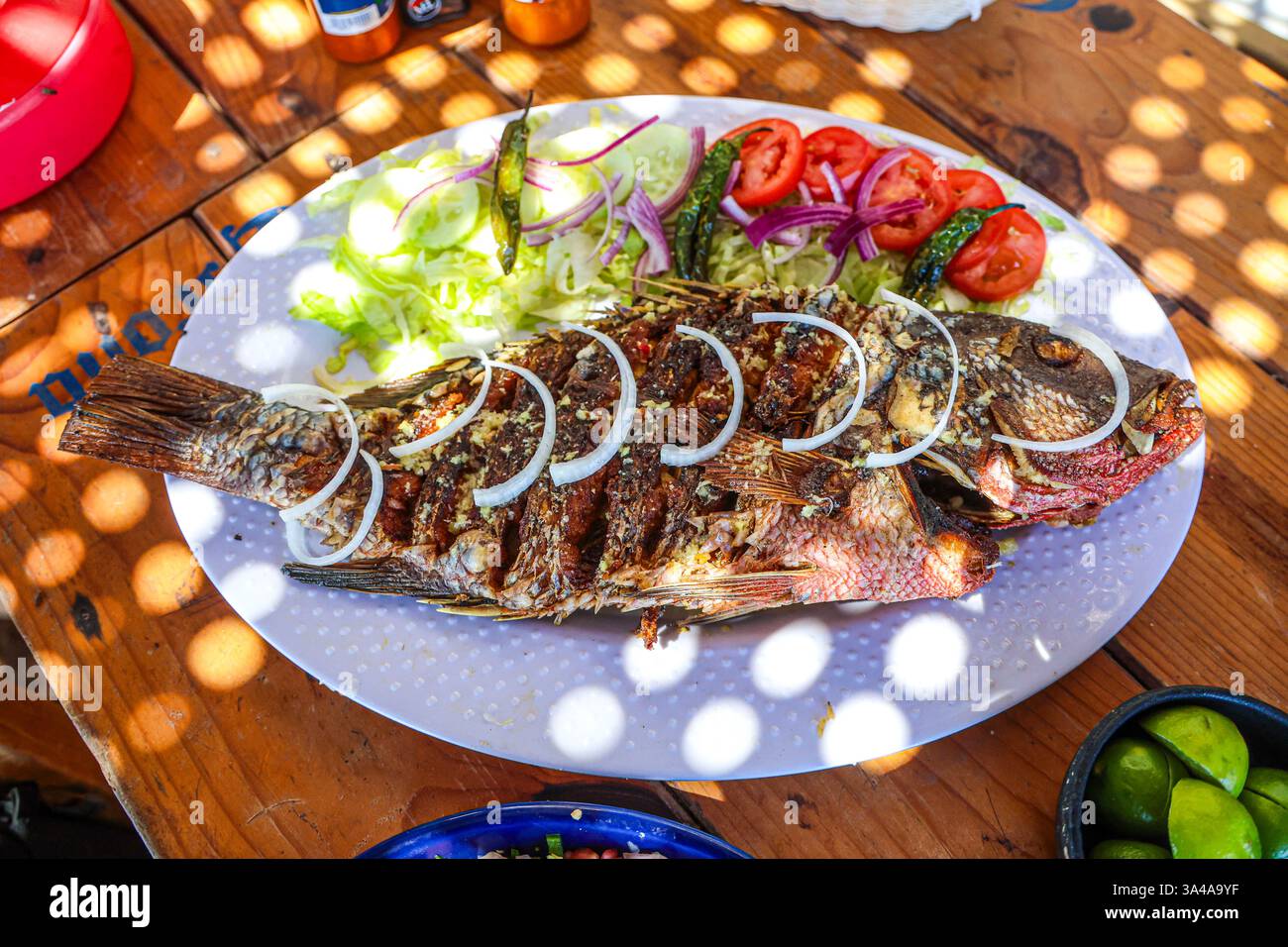 Fried snapper with garlic at El Dolphin restaurant on the beach in ...