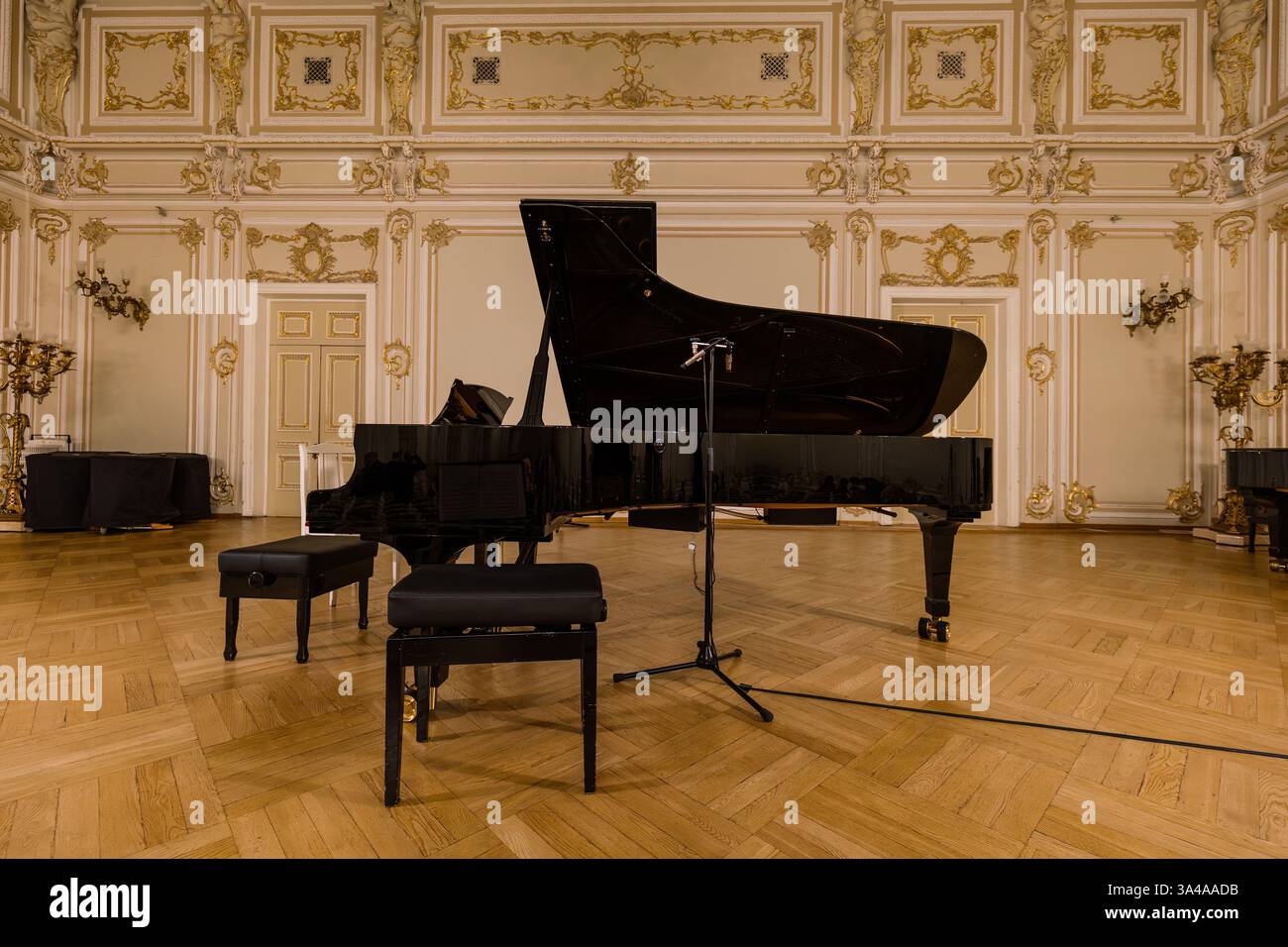 Piano at concert hall stage Stock Photo - Alamy