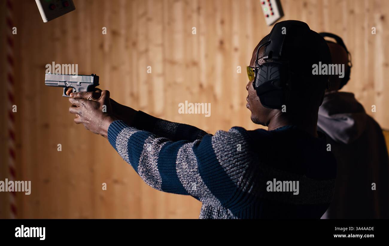 Man holds pistol, enjoying recreational shooting experience in firing ...