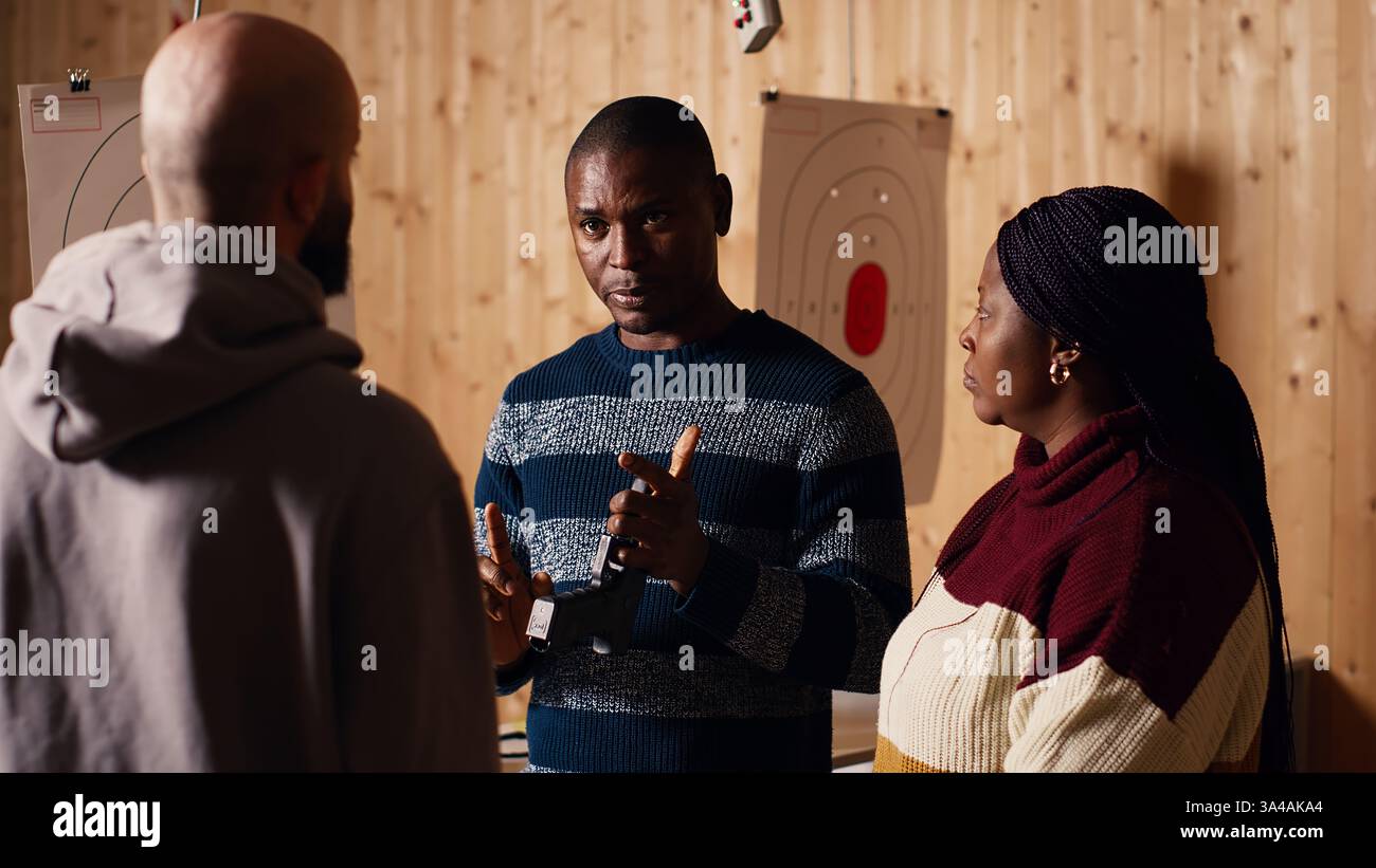 Shooting gallery safety officer explaining bullseye scoring system and ...