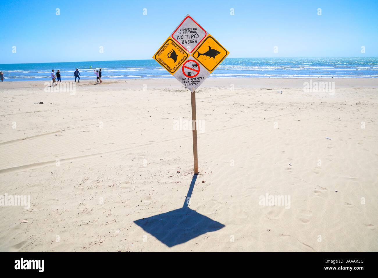A sign warning of the presence of stingrays and respecting marine ...