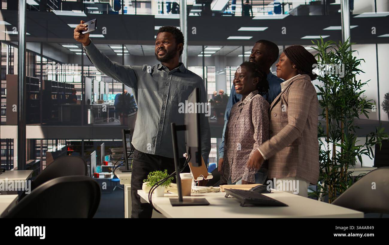 United african american employees taking photos at the corporate office ...